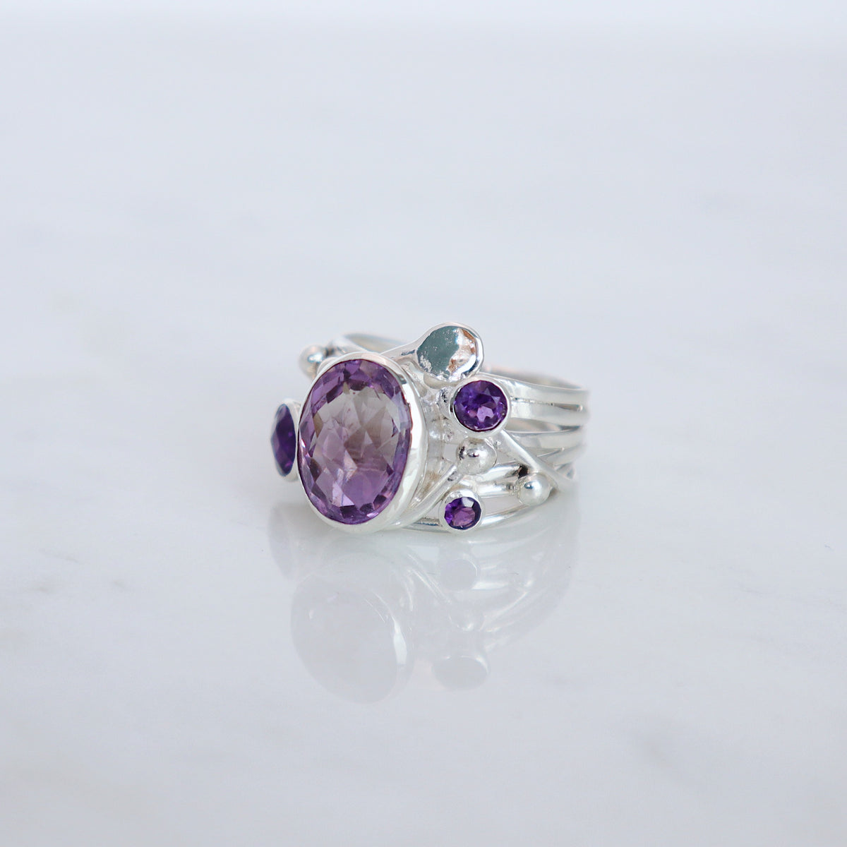 Silver Flowing Ring with Amethyst – angelaevansjewellery